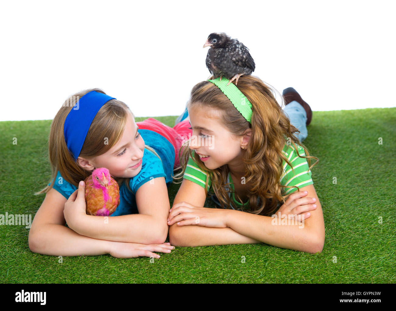 breeder hens kid sister farmer girls having fun with chicken chi Stock ...