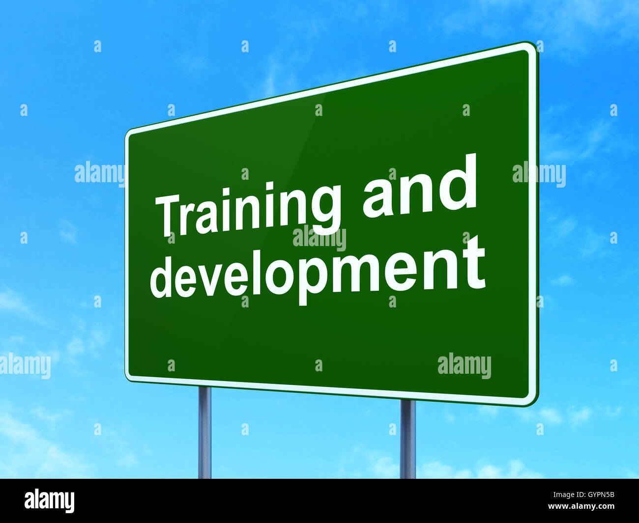 Education concept: Training and Development on road sign background ...