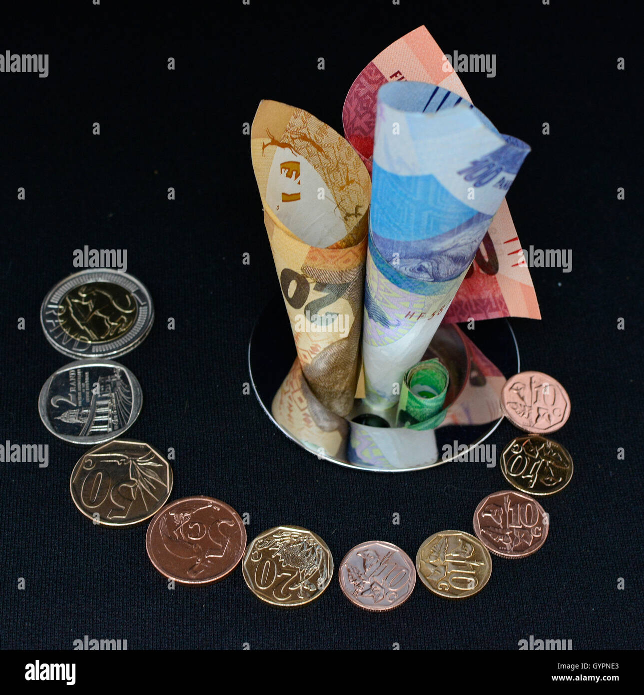 Money down the drain concept. Money lost. Money spent unwisely ...