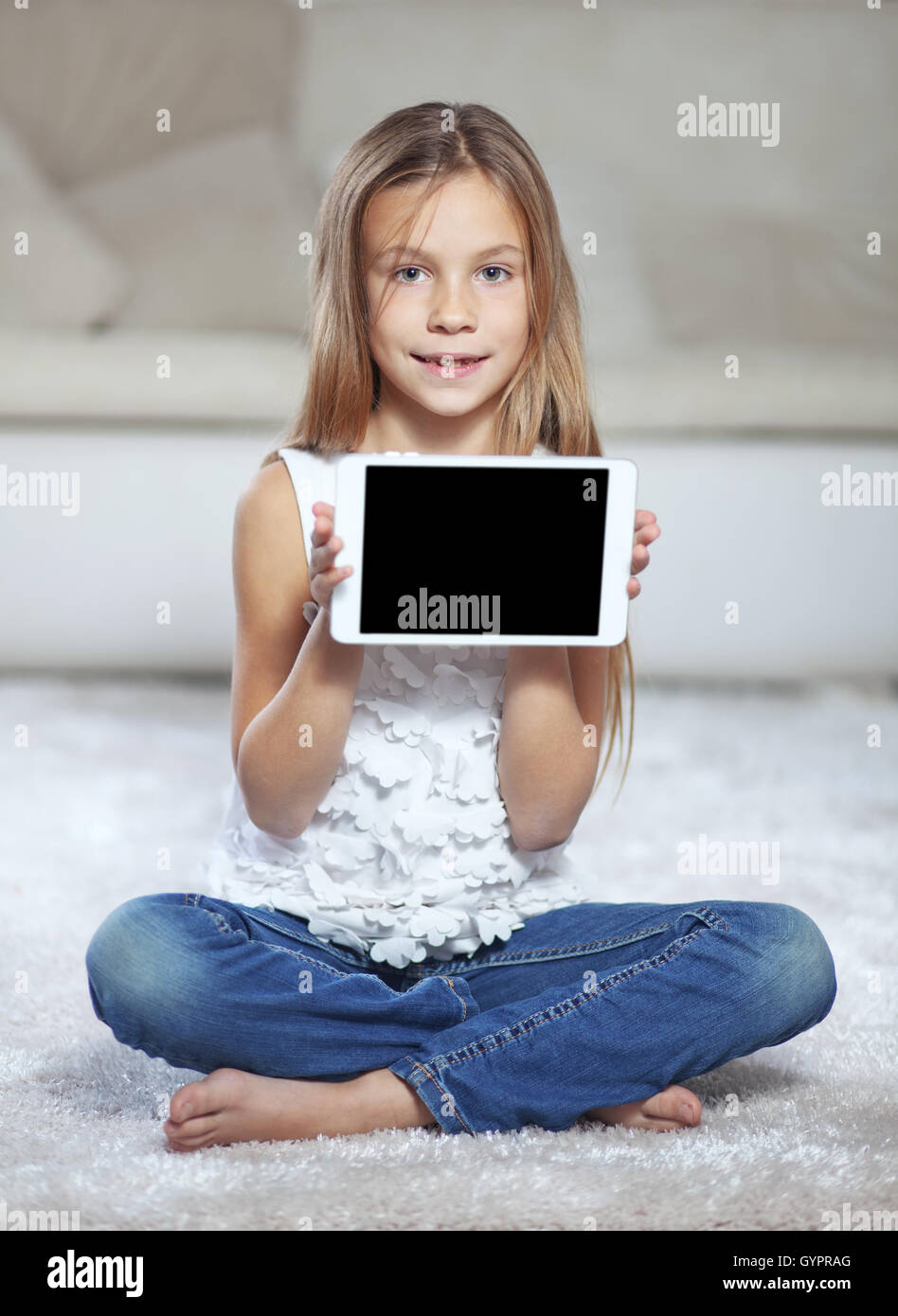 Child playing on tablet pc Stock Photo - Alamy