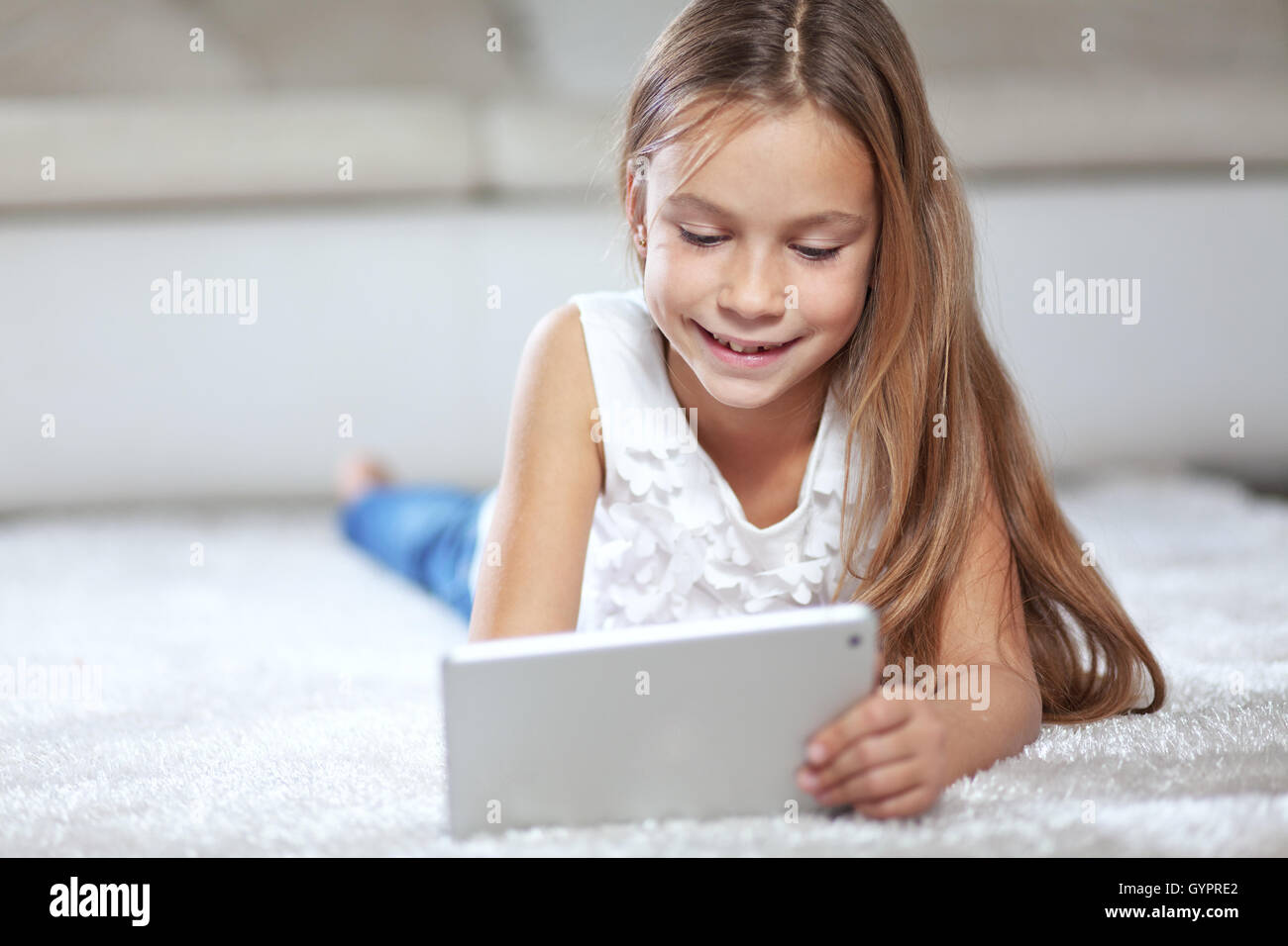 Child playing on tablet pc Stock Photo - Alamy