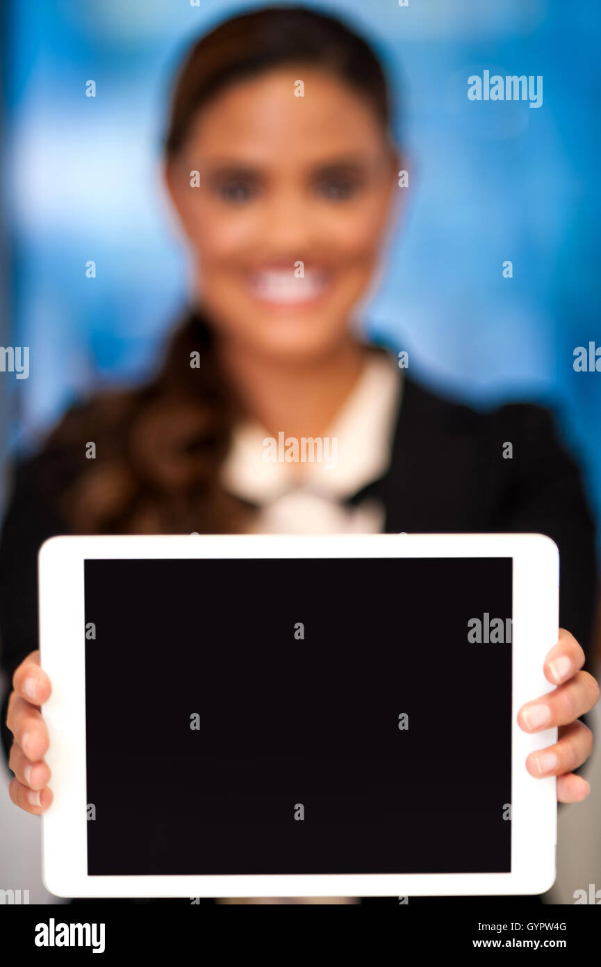 Corporate lady showing tablet device Stock Photo - Alamy