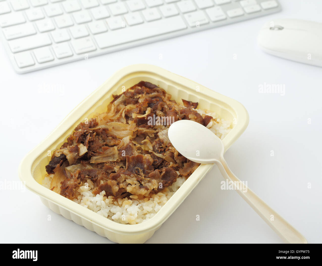 Unhealthy lunch box at office Stock Photo - Alamy
