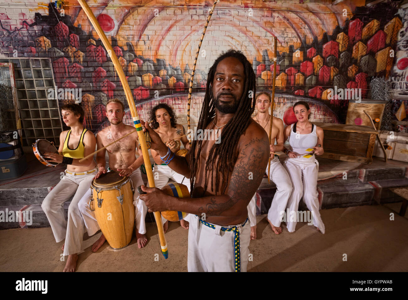 Capoeira Man with Dreadlocks and Instruments Stock Photo - Alamy