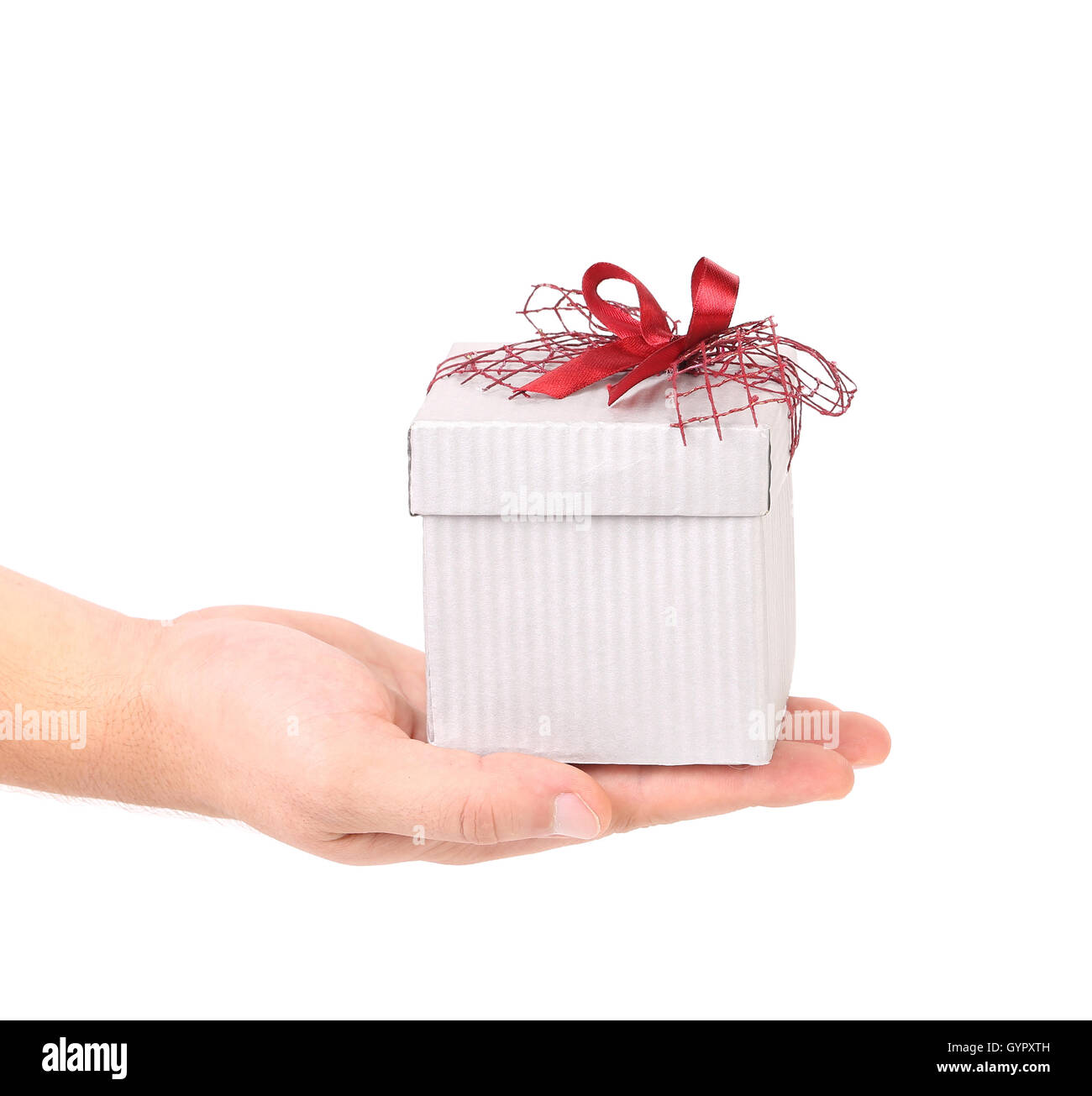 Hand holding gift in white package Stock Photo - Alamy
