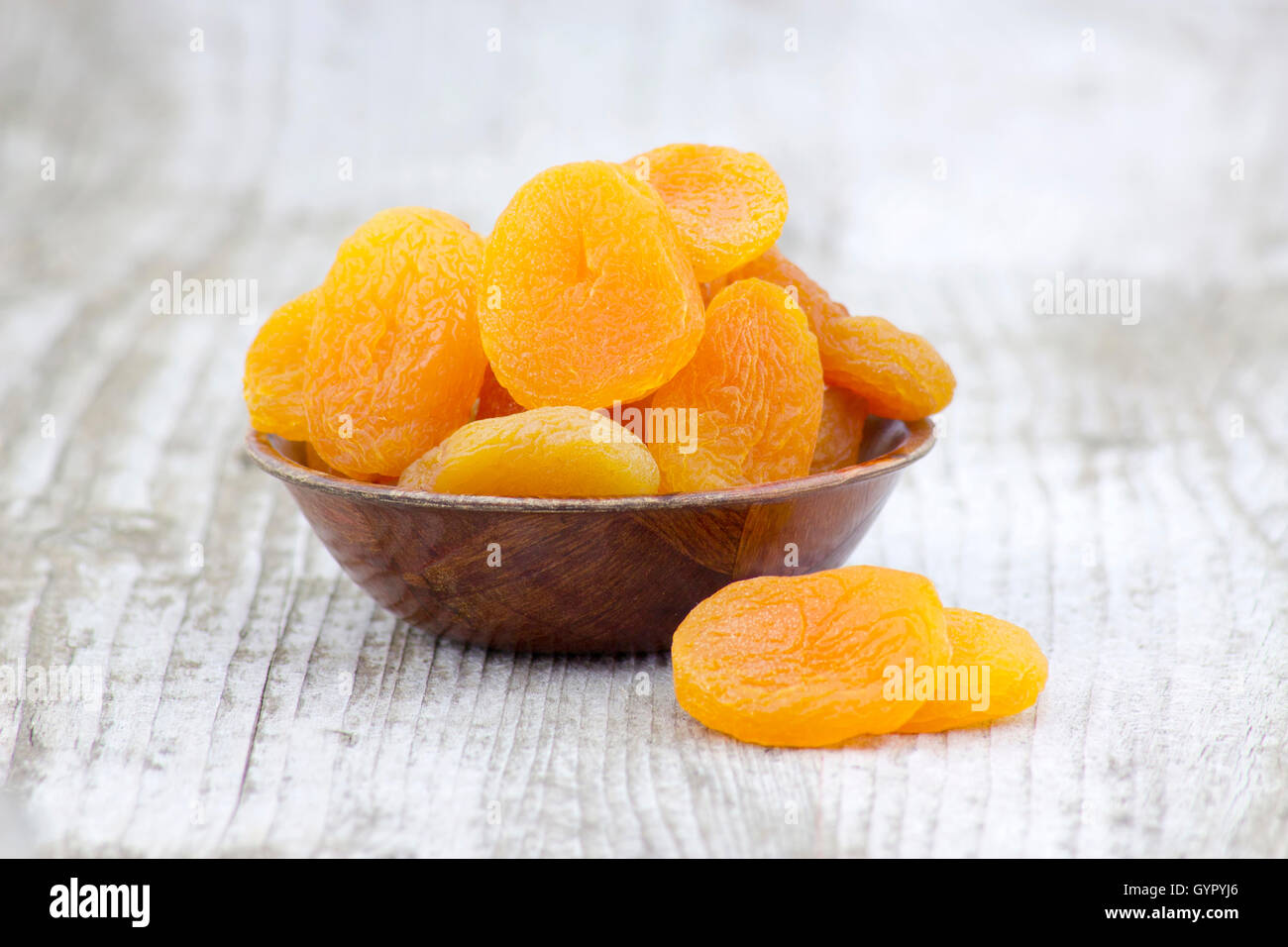 bowl full of dried apricots Stock Photo - Alamy