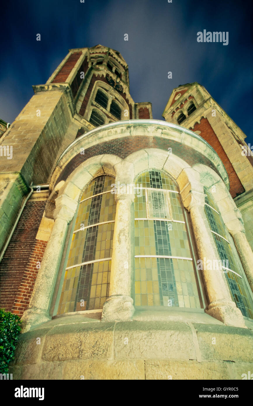 Stone church exterior facade windows at night Stock Photo - Alamy