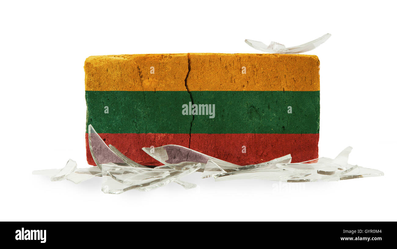 Brick with broken glass, violence concept Stock Photo - Alamy