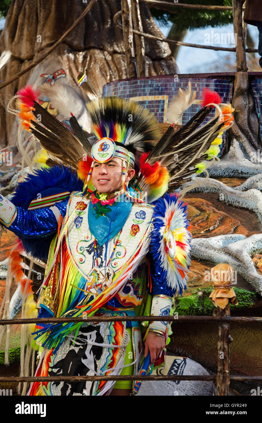A rider on the Oneida Indian Nation's float waves to the crowd at the ...