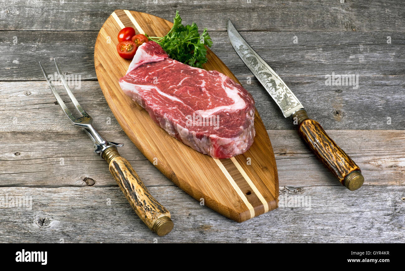 Fresh two inch thick rib eye steak ready to cook Stock Photo - Alamy