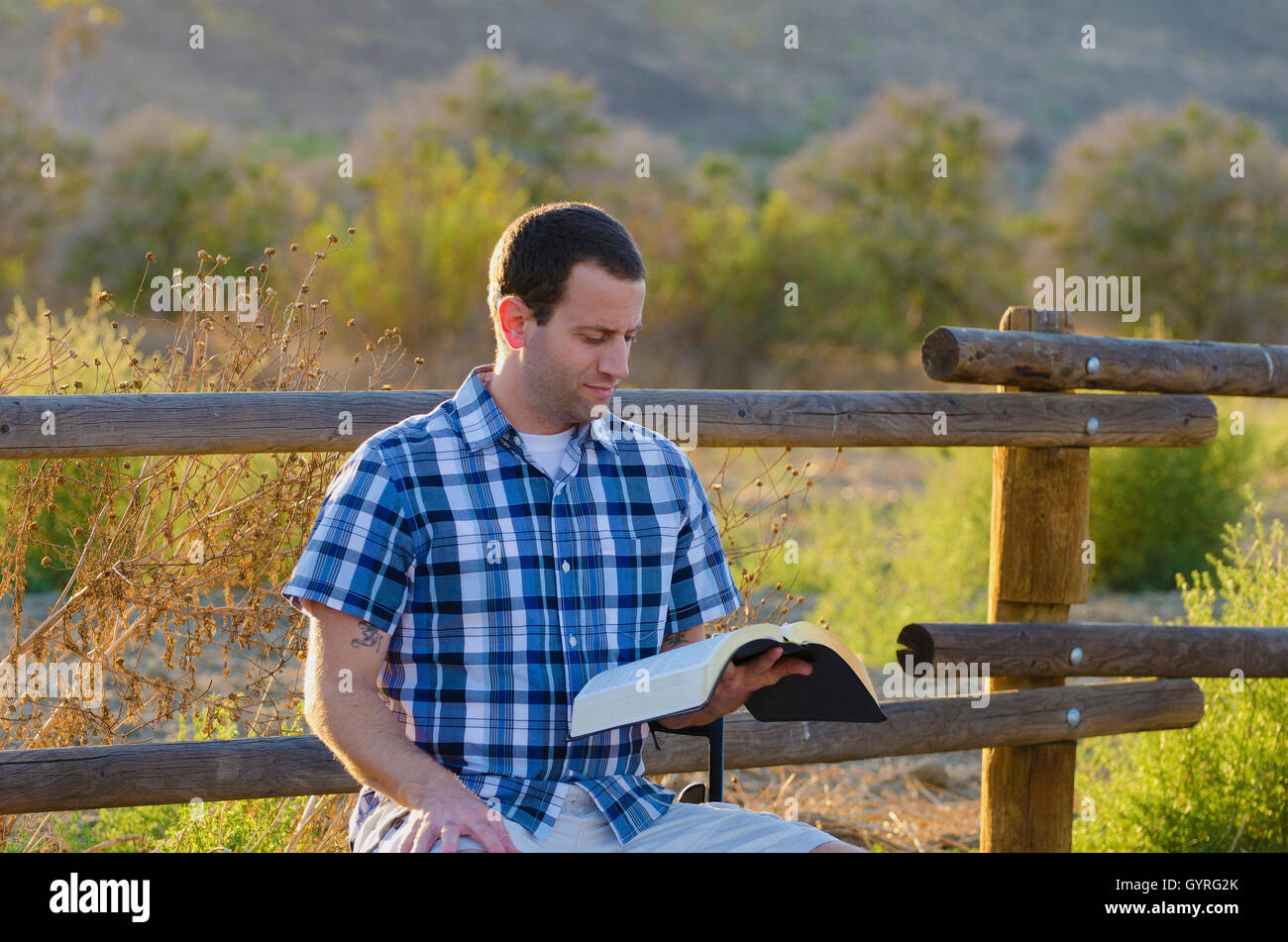 Man reading holy bible hi-res stock photography and images - Alamy