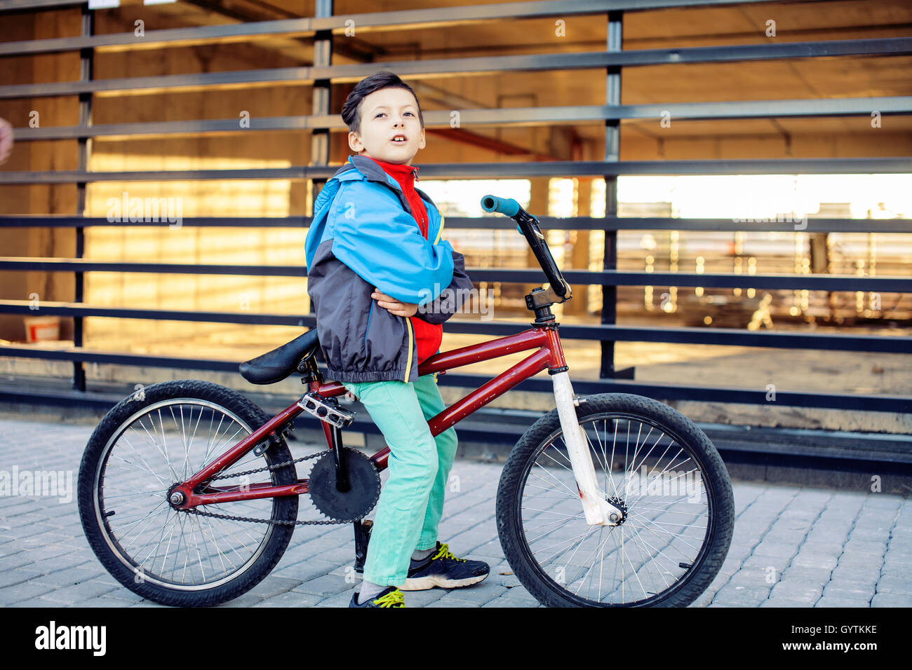 young kid on cool bmx bicycle riding outside, lifestyle people concept ...