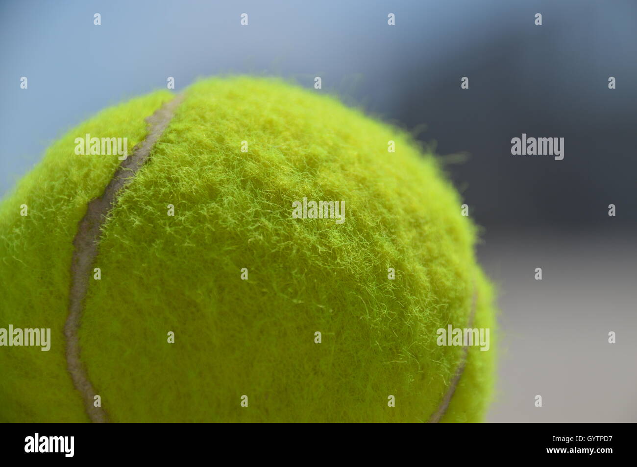 This is a photo taken of a generic Tennis ball, focused on aperture ...