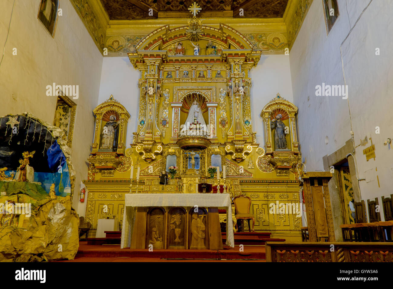 Heavily golden religious decorated alter inside San Diego church shot ...