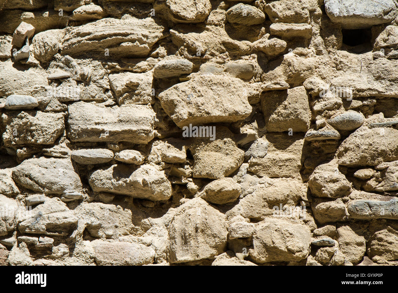 detail of the old wall of the ruined stones and without plaster Stock ...