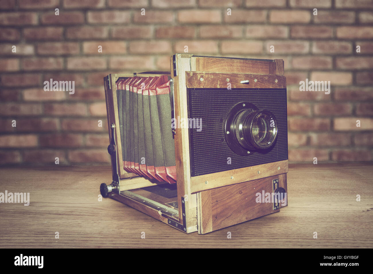 Antique Old photo Camera on wooden table Stock Photo - Alamy