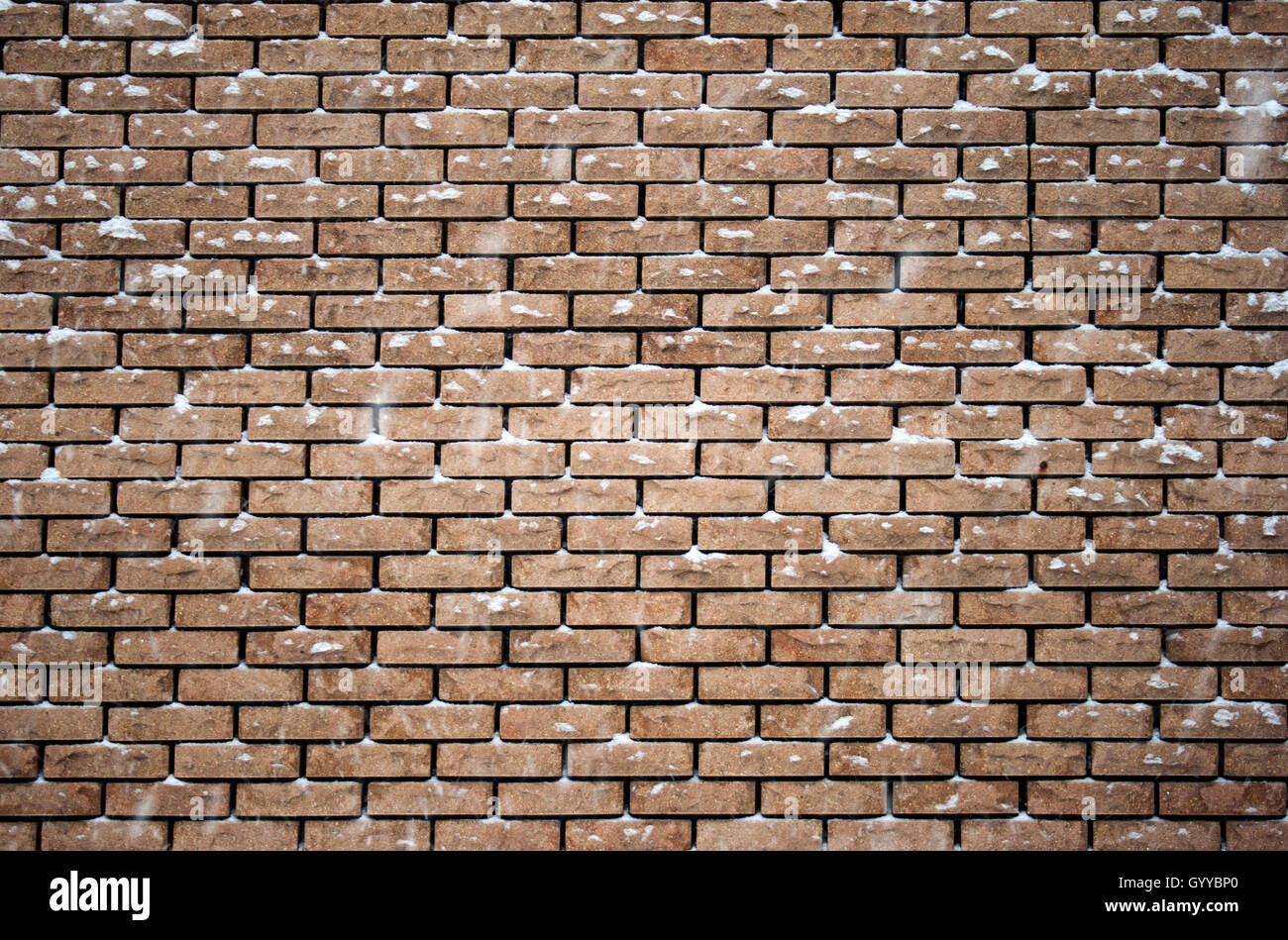 Snow sticking to an old brick wall Stock Photo - Alamy