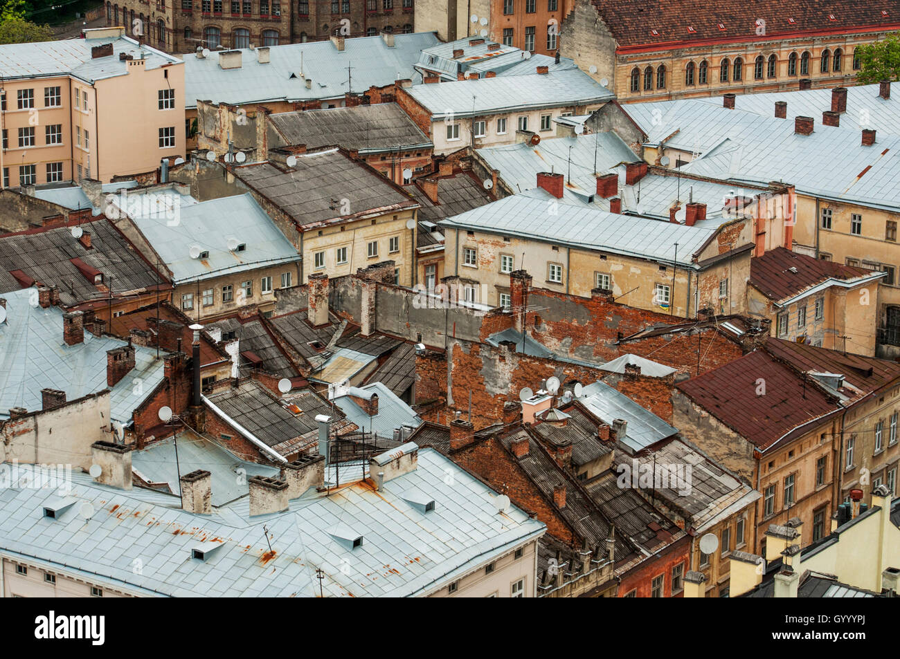 Many shabby roofs of old city from the top in rainy day Stock Photo - Alamy
