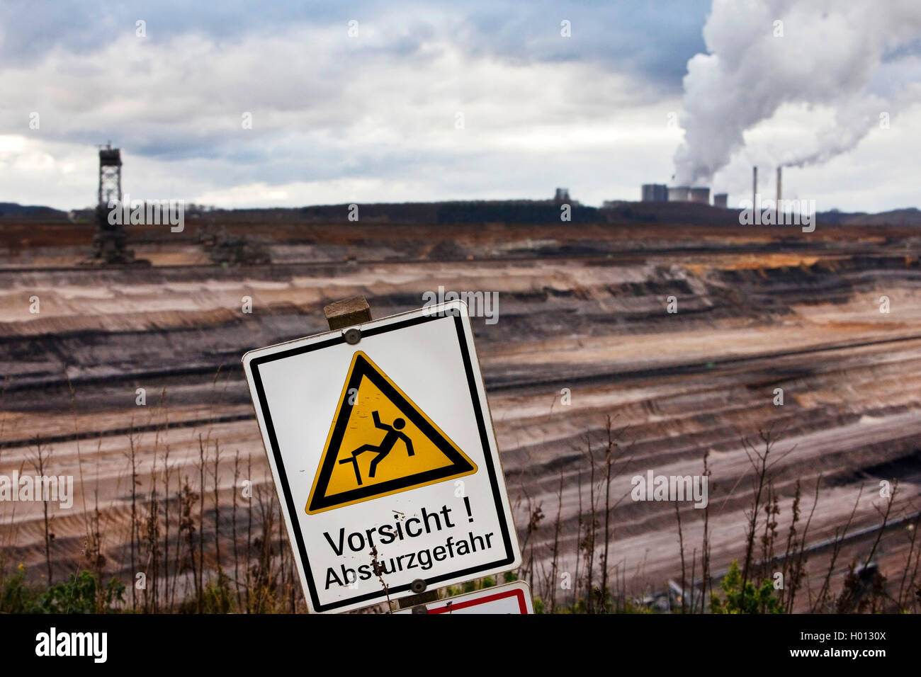 warning sign in front of brown coal surface mining Inden, Germany ...