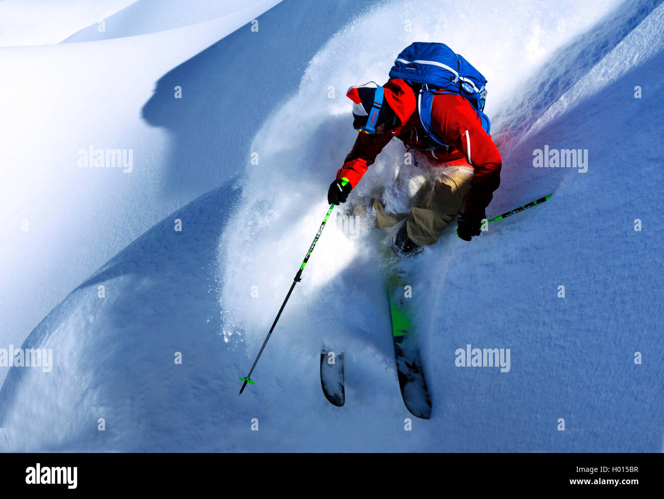 parallel turn of a freerider in deep powder snow, France, Savoie, La ...