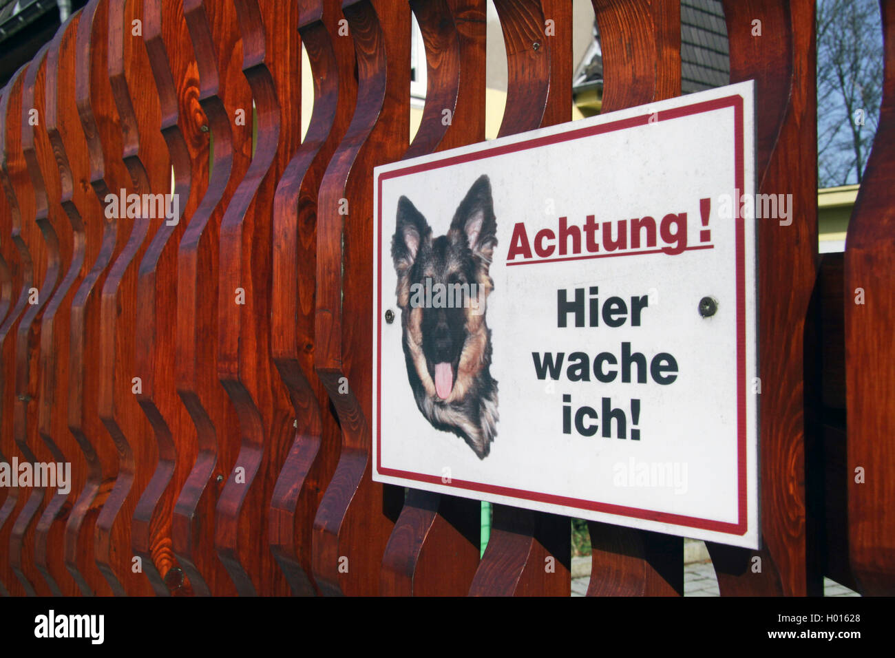 German Shepherd Dog (Canis lupus f. familiaris), warning sign for a ...