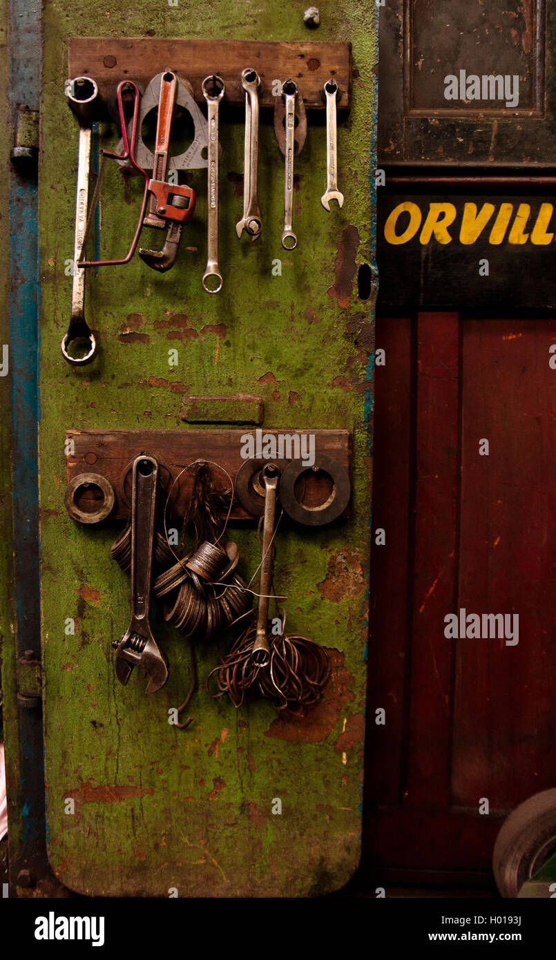 Old tools hanging in a workshop Stock Photo - Alamy