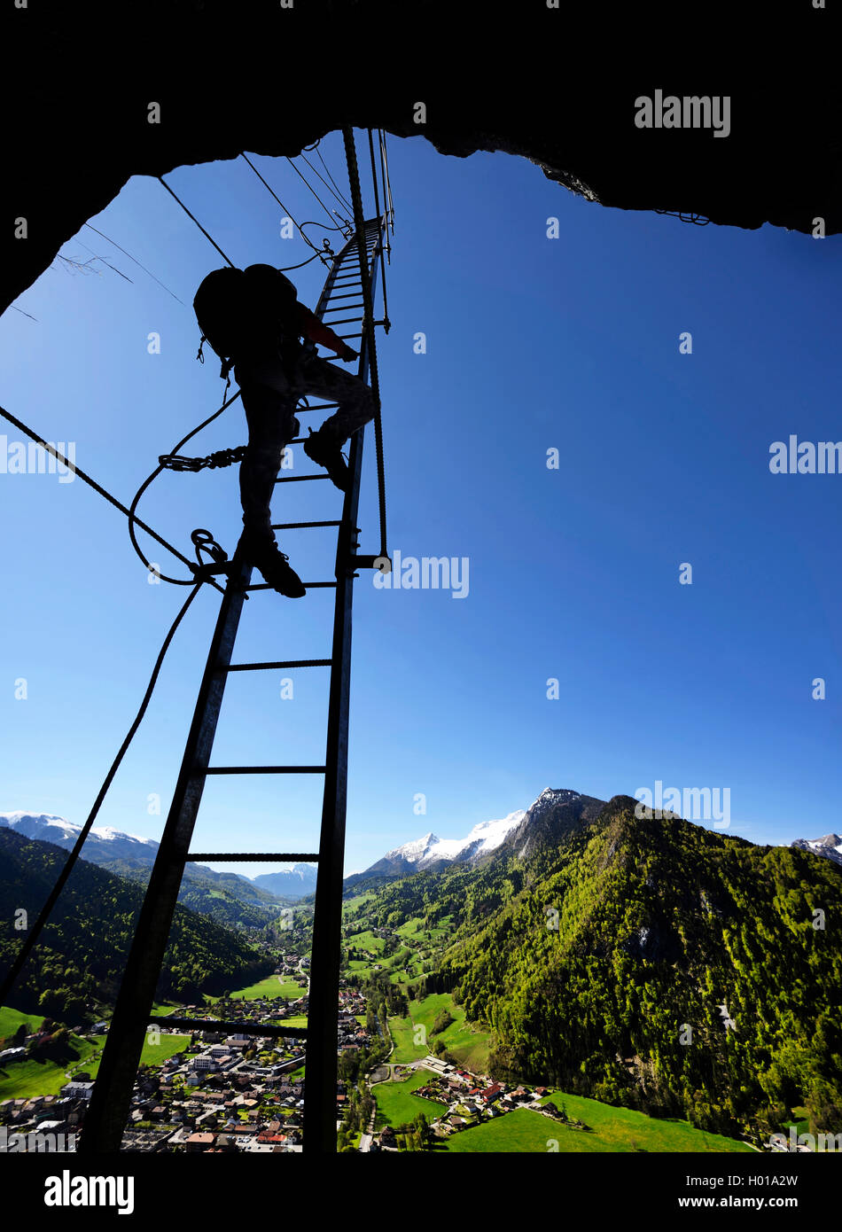 climber on a ladder in the mountains, Via ferrata du Mont, France ...