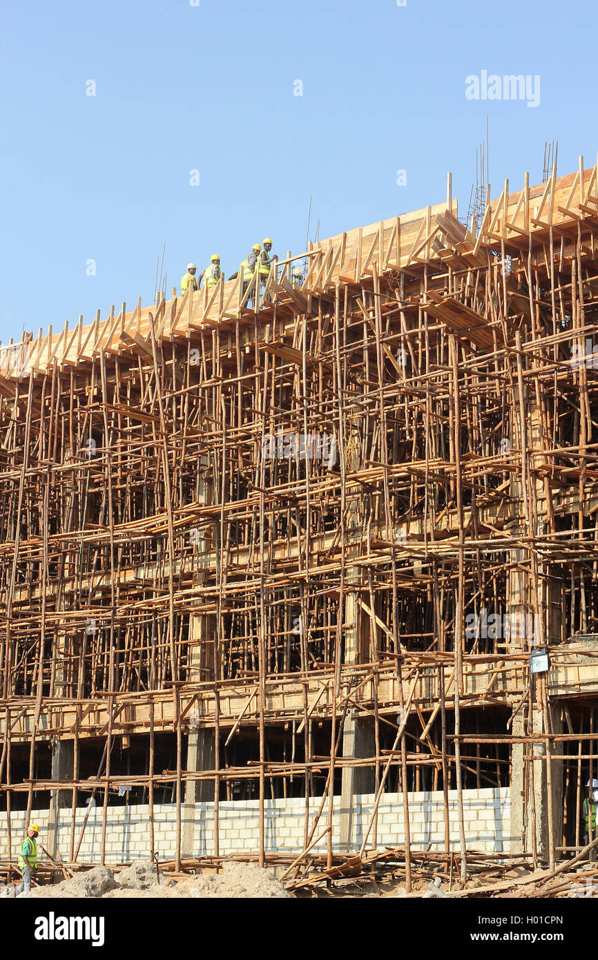 Workers constructing a sports stadium in Wakiso district in Uganda ...