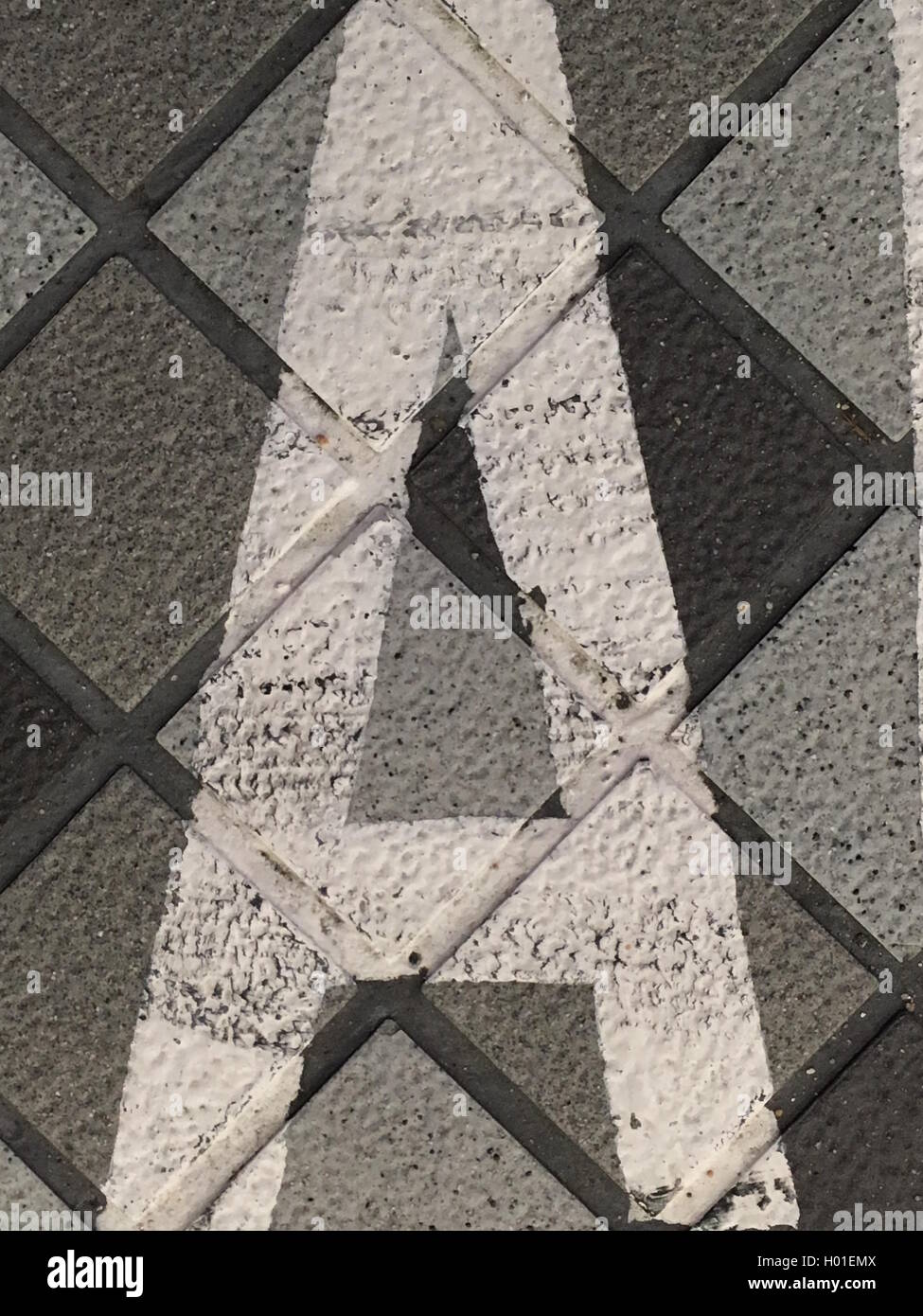 Letter A painted on the tile floor Stock Photo - Alamy