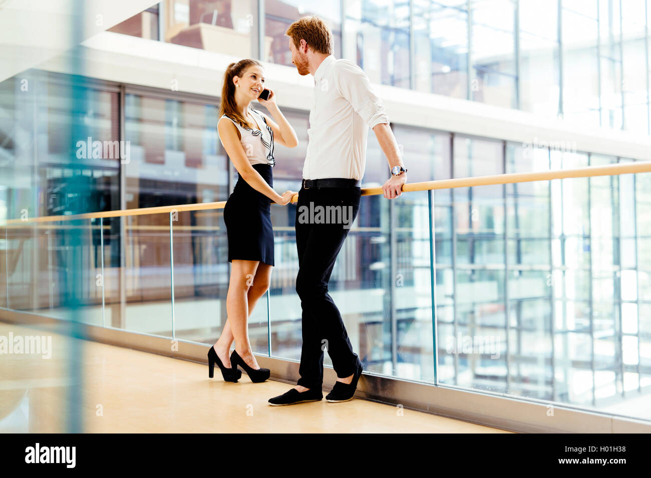 Business people having a break and using phones Stock Photo - Alamy