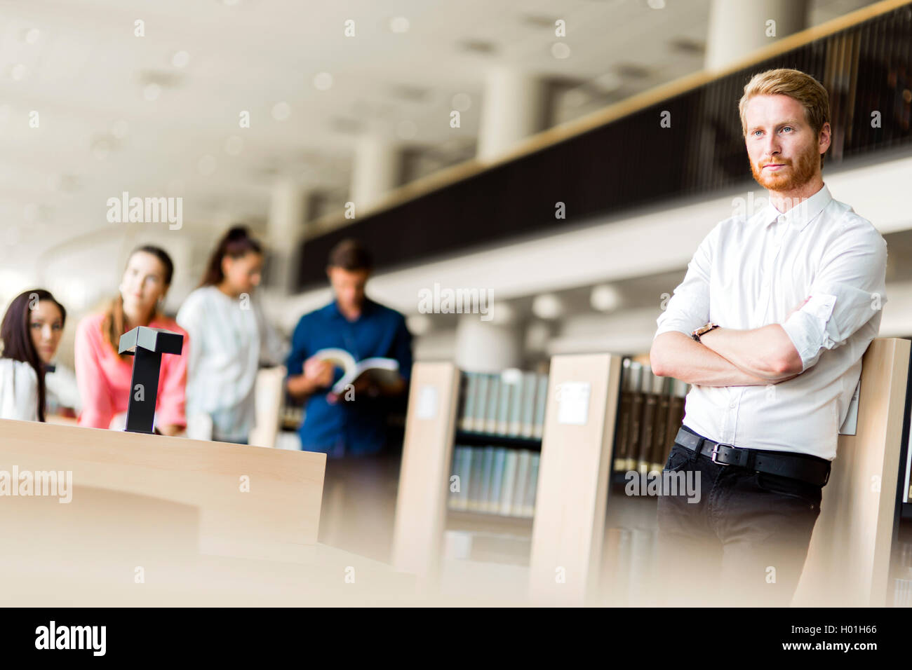 Group of smart young people educating themselves in a library Stock ...