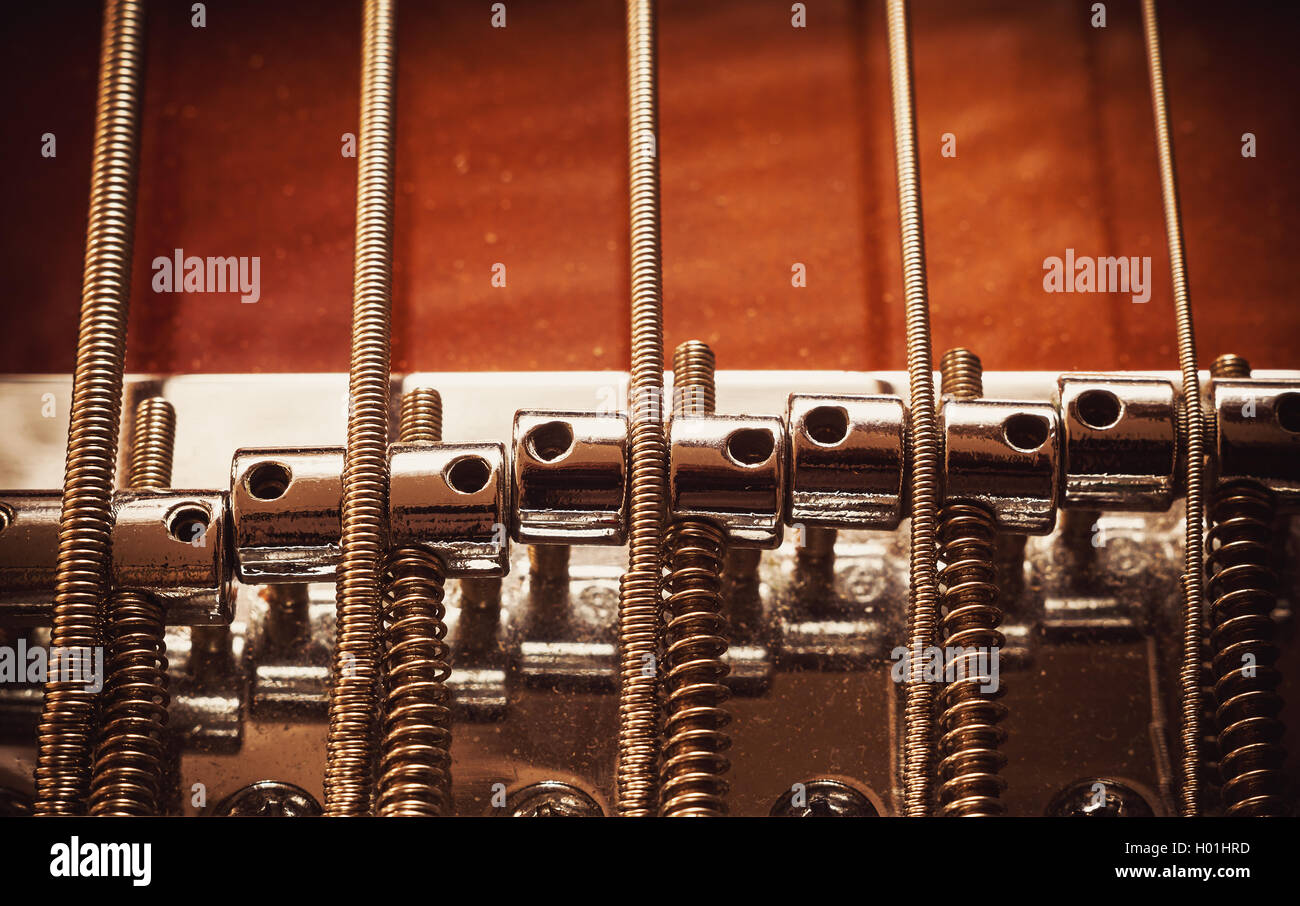 Closeup view on details of strings of jazz bass guitar Stock Photo - Alamy