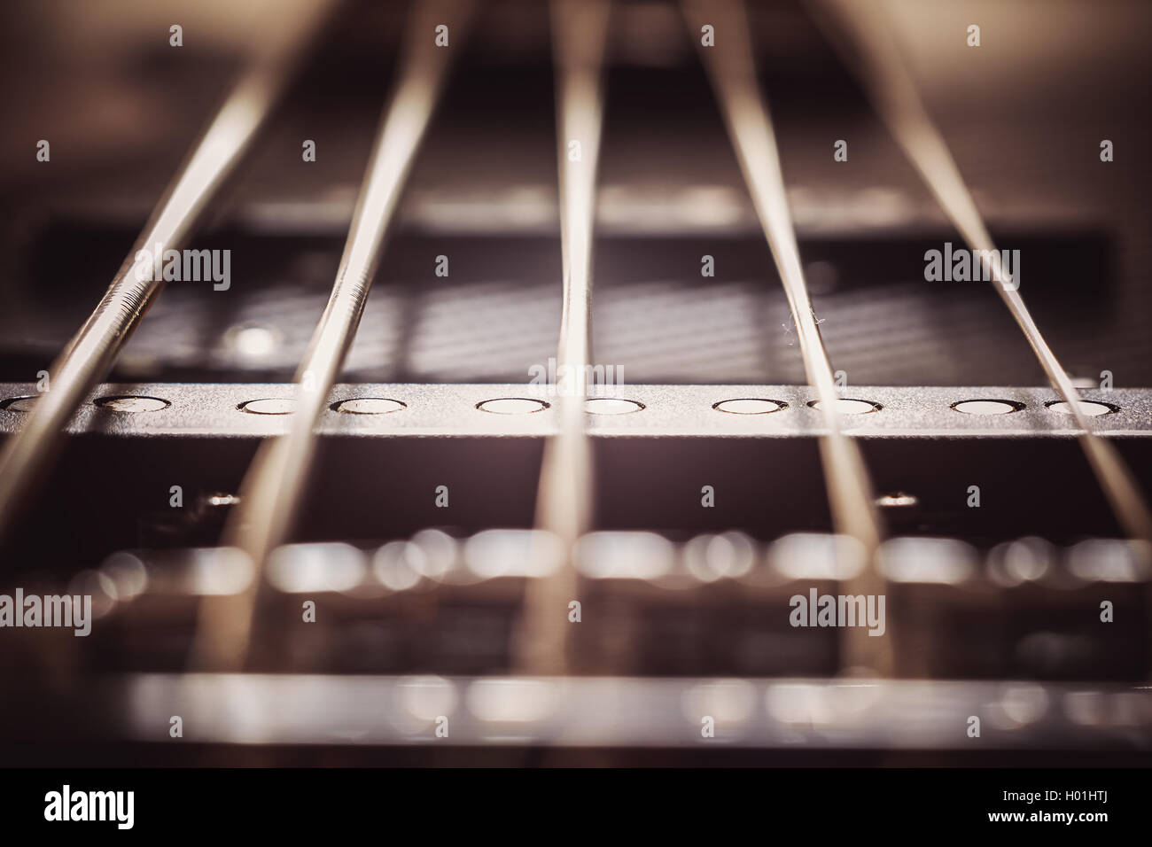 Closeup view on details of strings of jazz bass guitar Stock Photo - Alamy