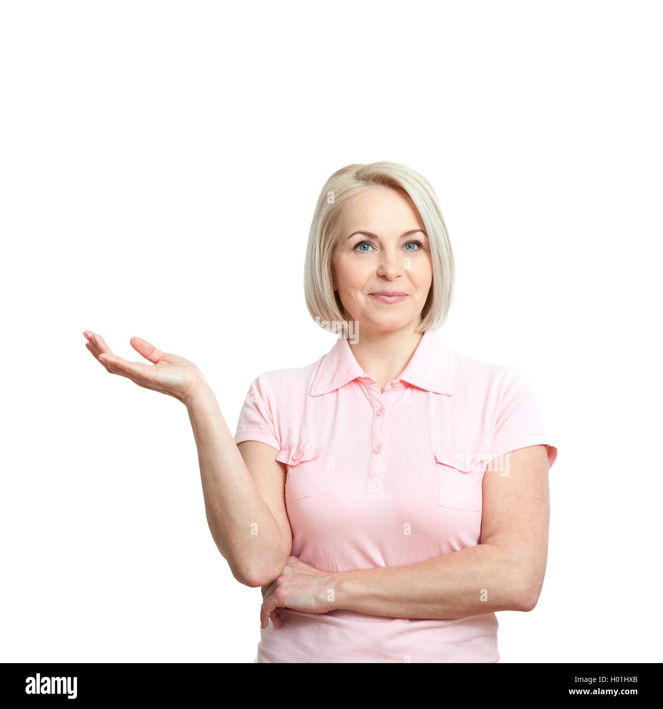Friendly smiling middle-aged woman pointing at copyspace isolate Stock ...