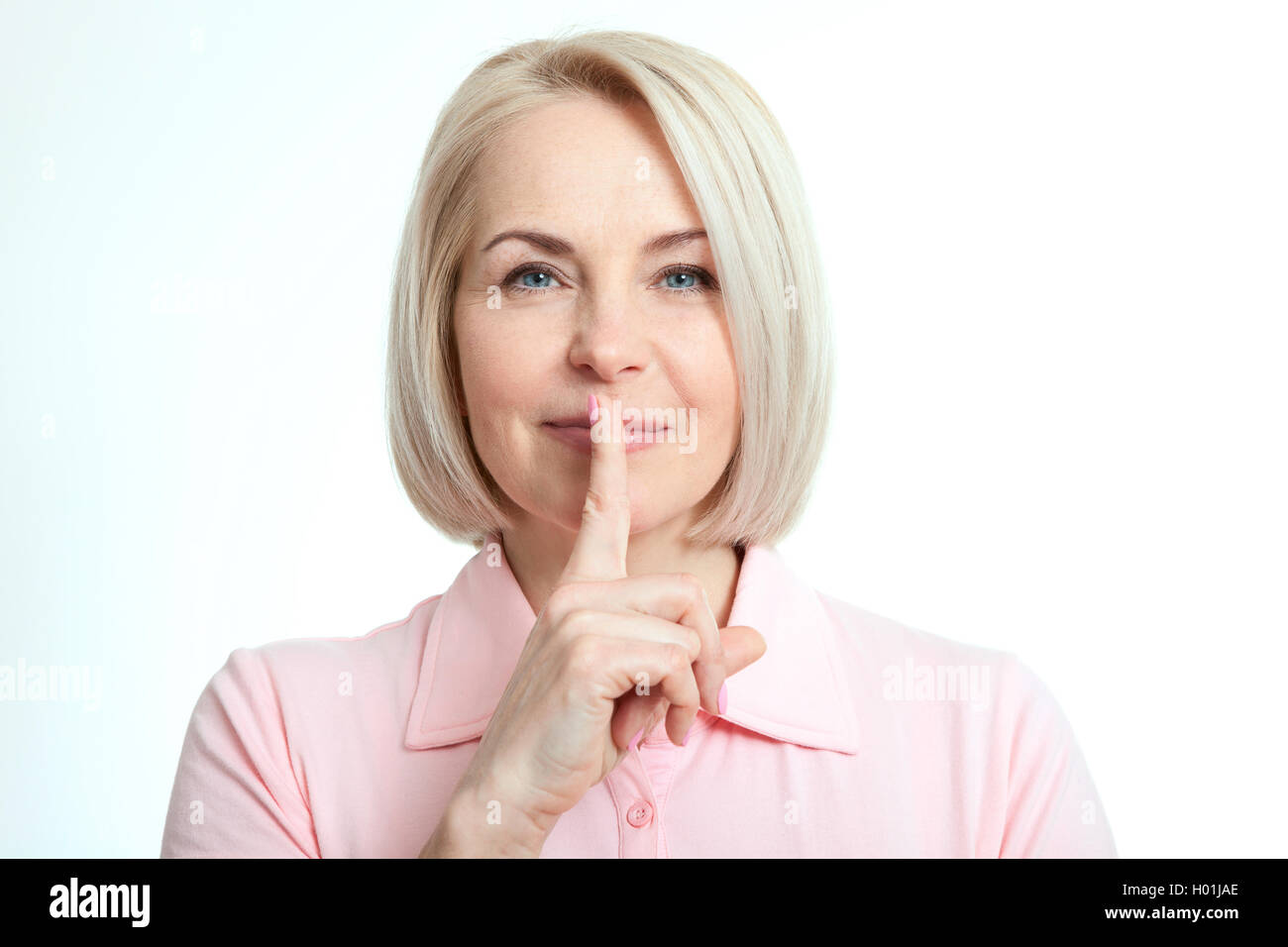 Portrait woman with finger on lips, or secret gesture hand sign ...