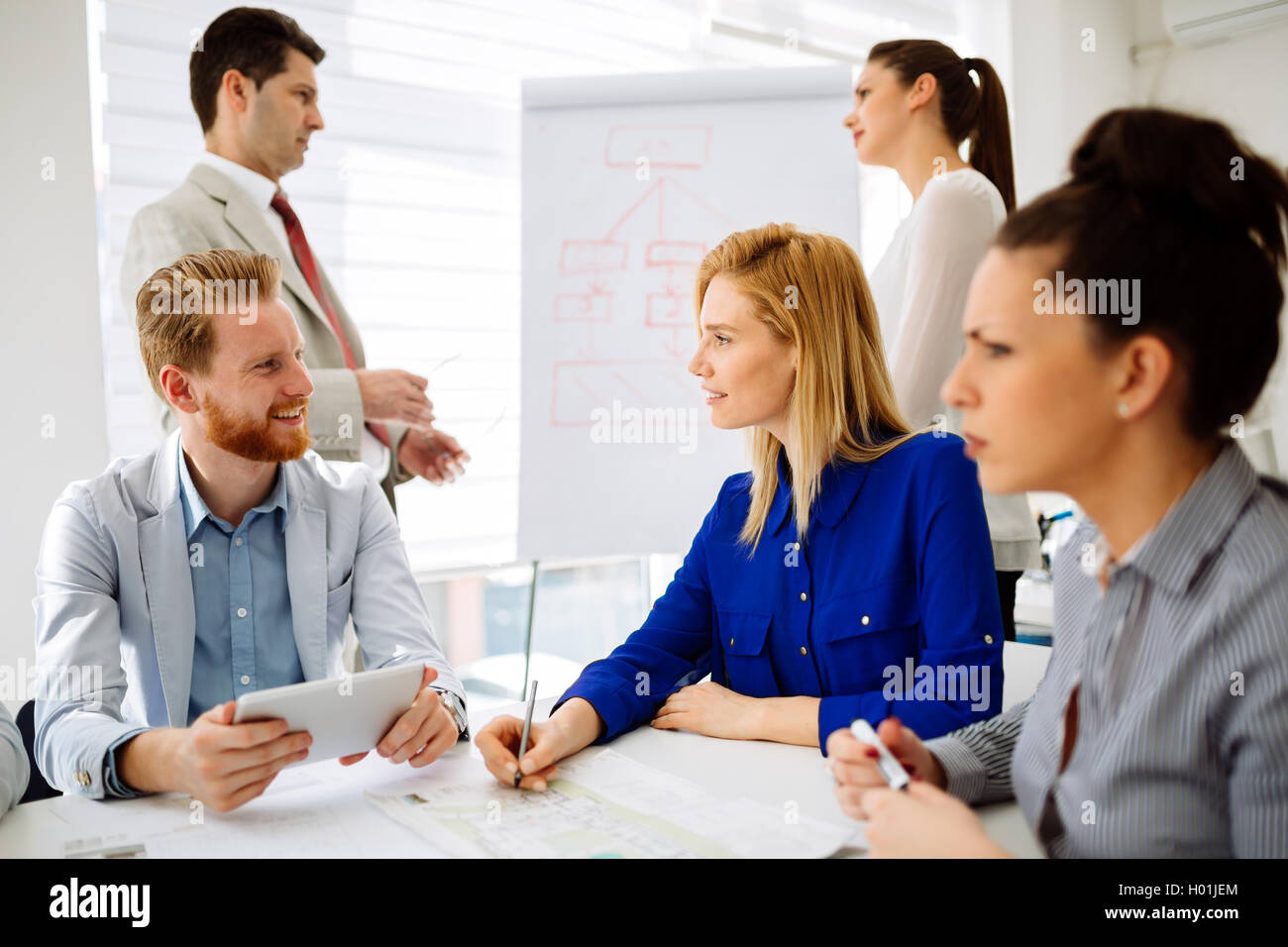 Business people meeting and a busy day at the office Stock Photo - Alamy