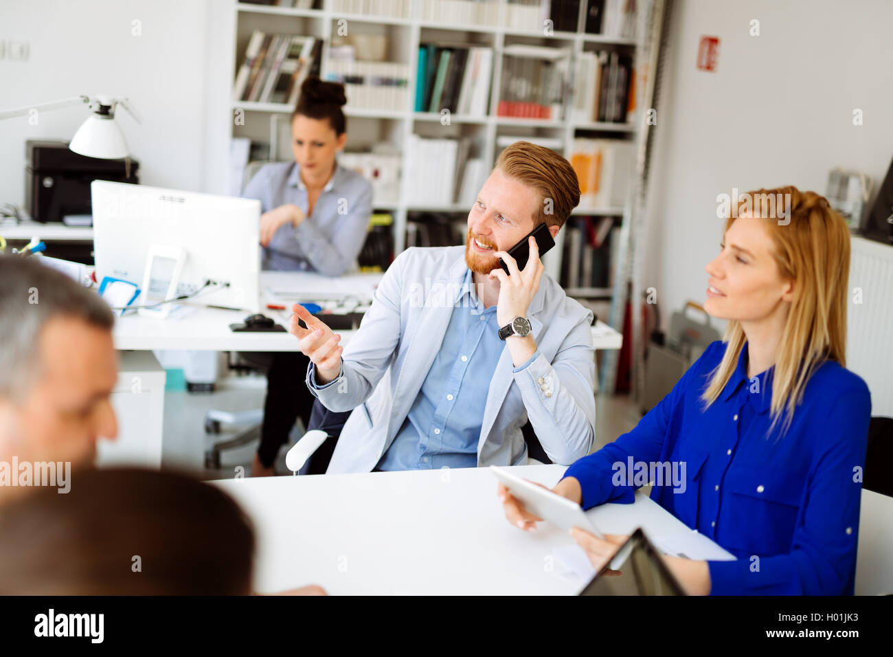 Busy business people working in office Stock Photo - Alamy