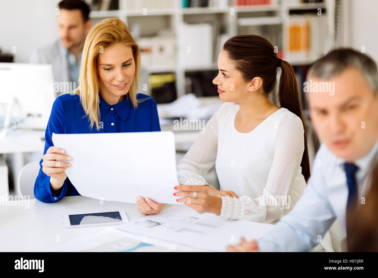 SucceSSful business partners brainstorming in office Stock Photo - Alamy