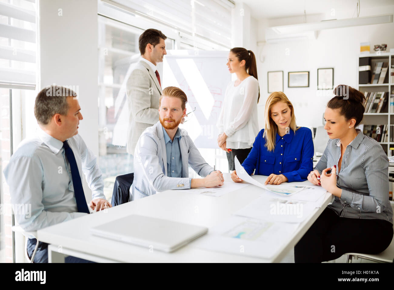 Presentation and collaboration by business people in office Stock Photo ...