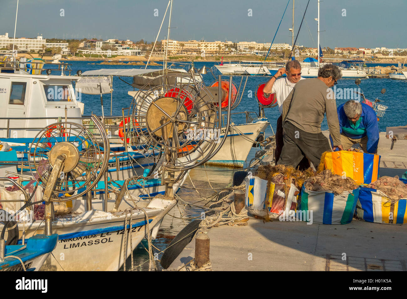 Fishermen Packing Up The Nets Paphos Cyprus Stock Photo - Alamy