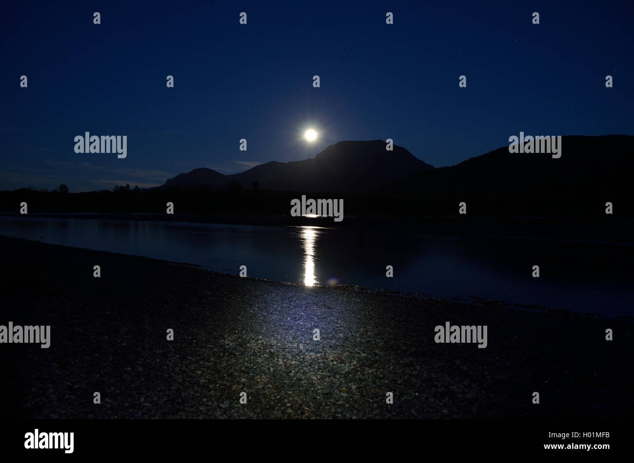 full moon over night mountain with reflection on river surface Stock ...