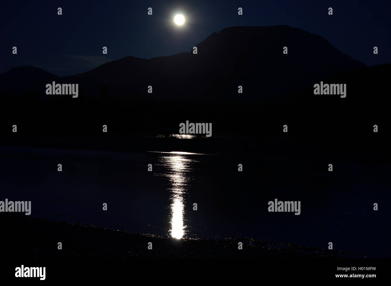 full moon over night mountain with reflection on river surface Stock ...