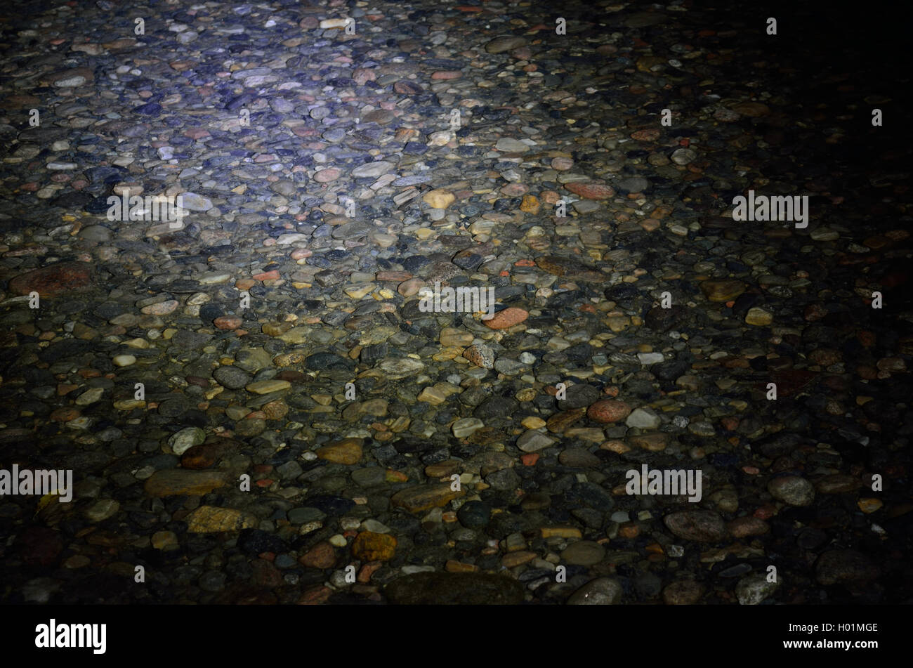 illuminated river rock at night under water Stock Photo - Alamy