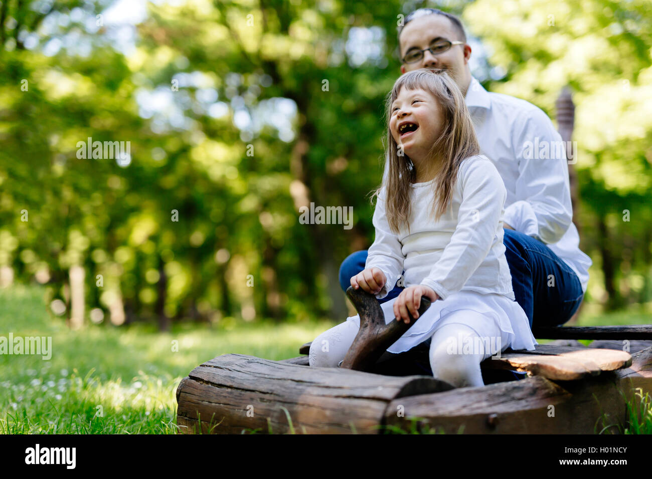 People with down syndrome having fun outdoors and smiling Stock Photo ...
