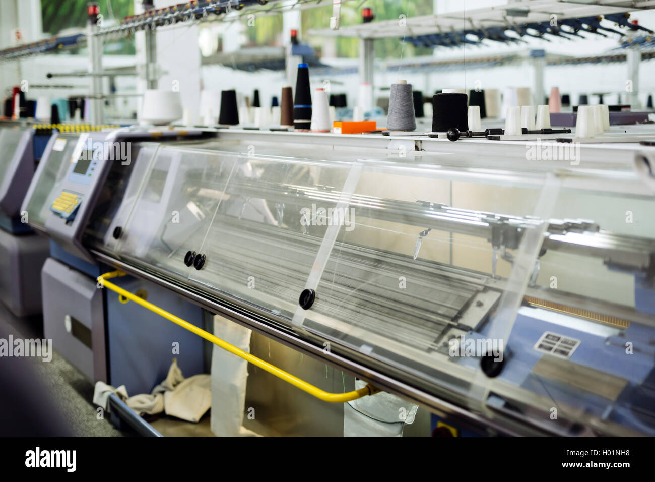 Computerized knitting machines in textile factory Stock Photo - Alamy