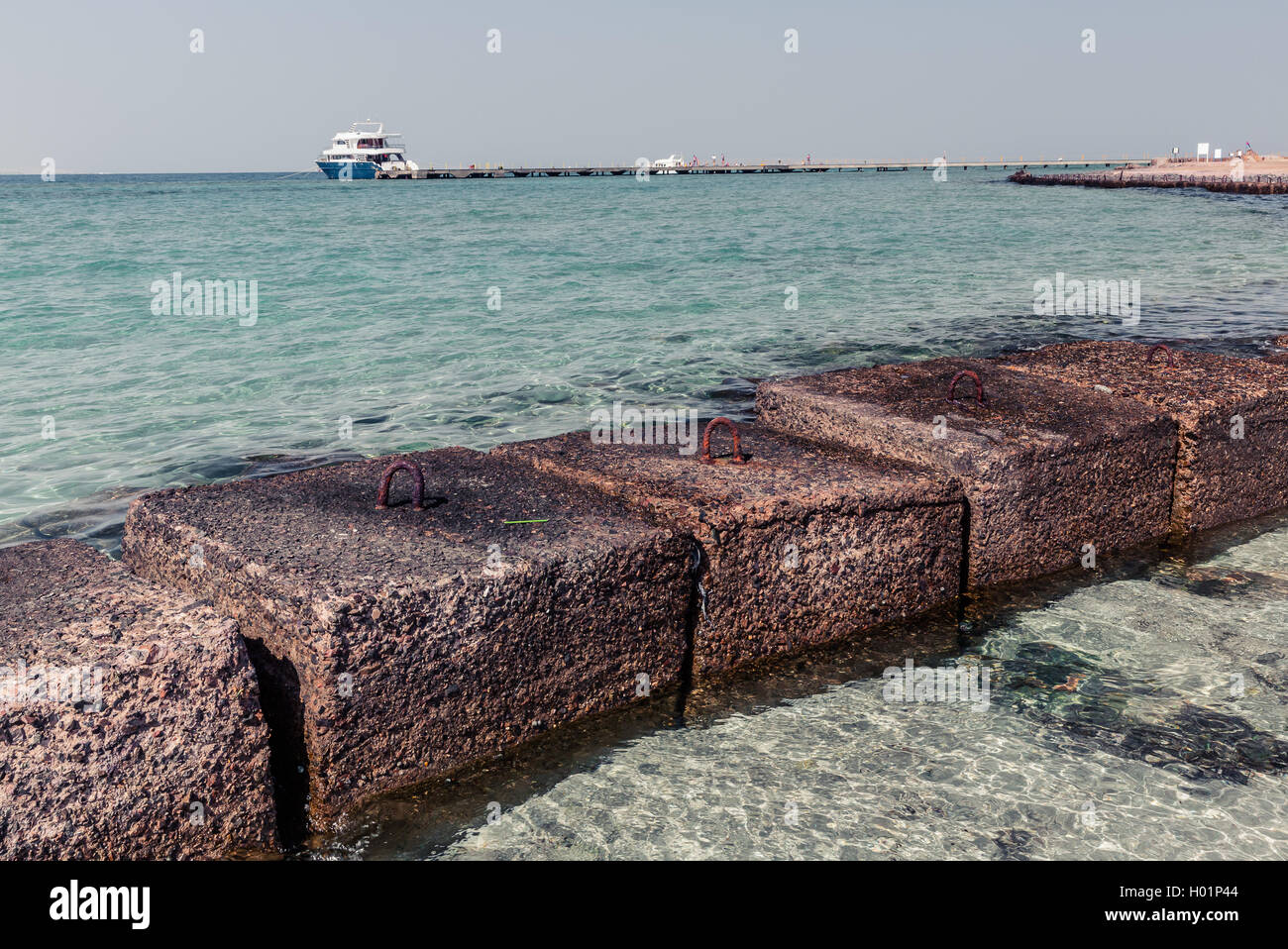 Stone breakwater in the sea Stock Photo - Alamy