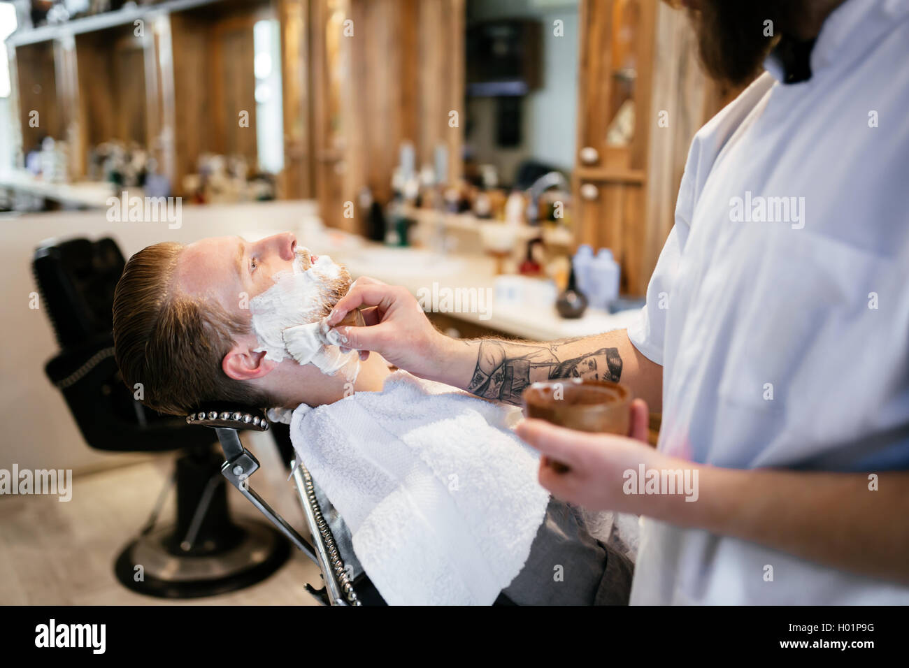 Male in barber shop taking care of hair mustache and beard Stock Photo ...
