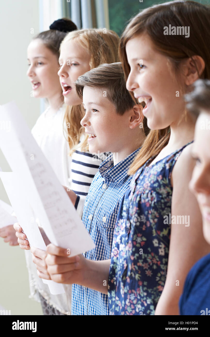 Group Of Children Enjoying Singing Group Stock Photo - Alamy