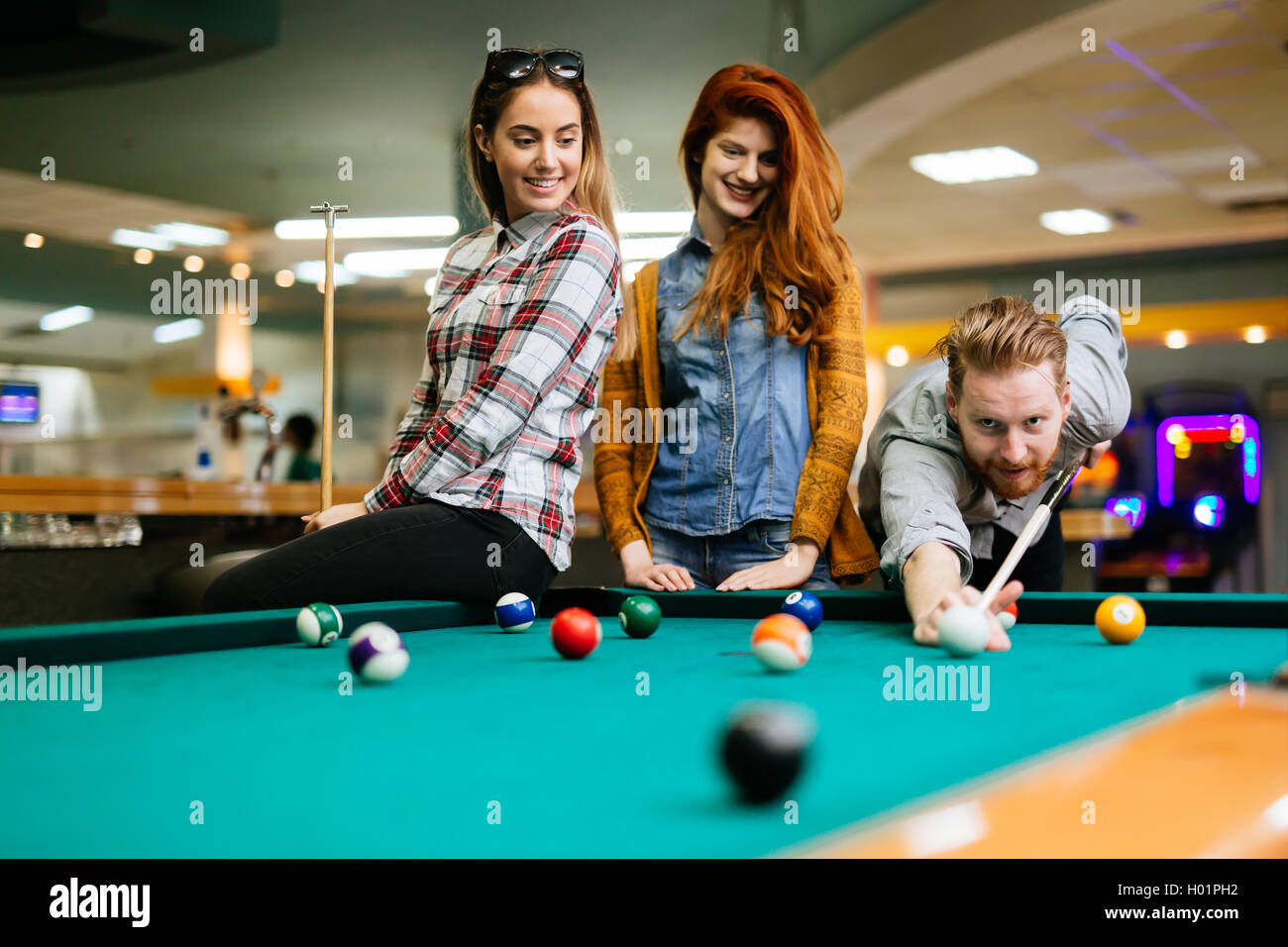 Group enjoying game pool together hi-res stock photography and images ...