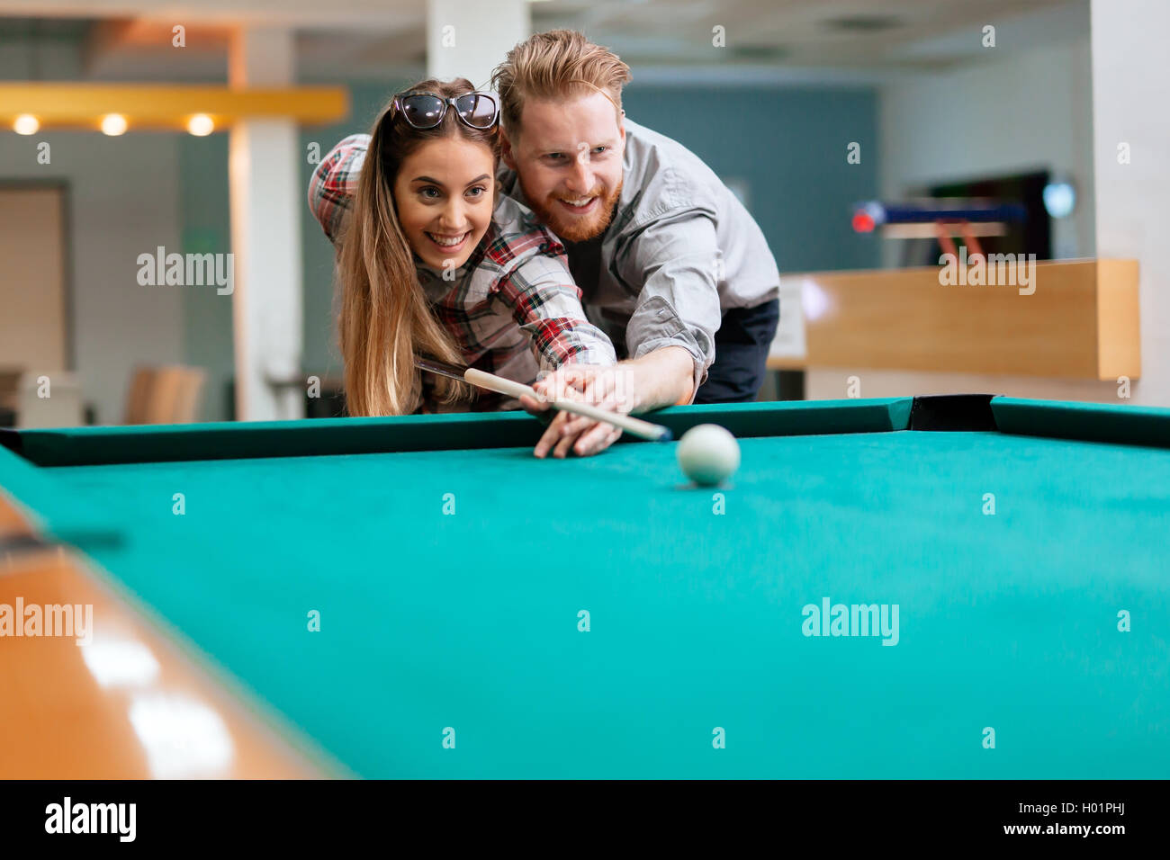 Two women shooting pool hi-res stock photography and images - Alamy